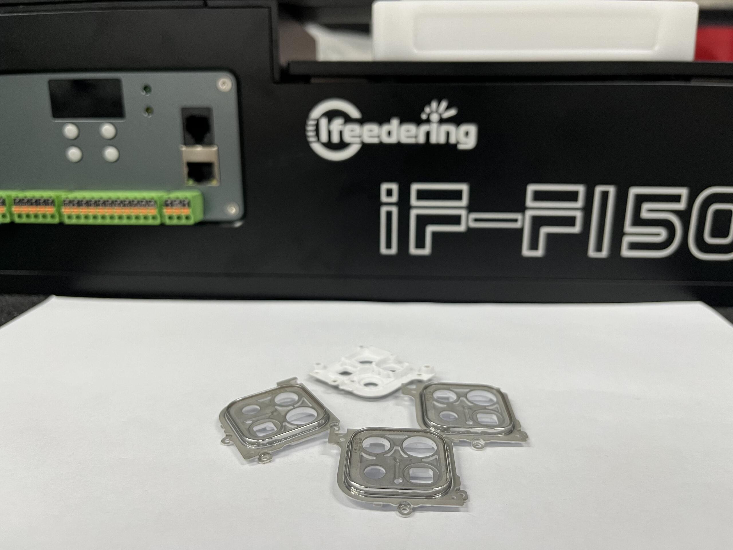 Automating Mobile Phone Camera Cover Handling with Flexible Feeders